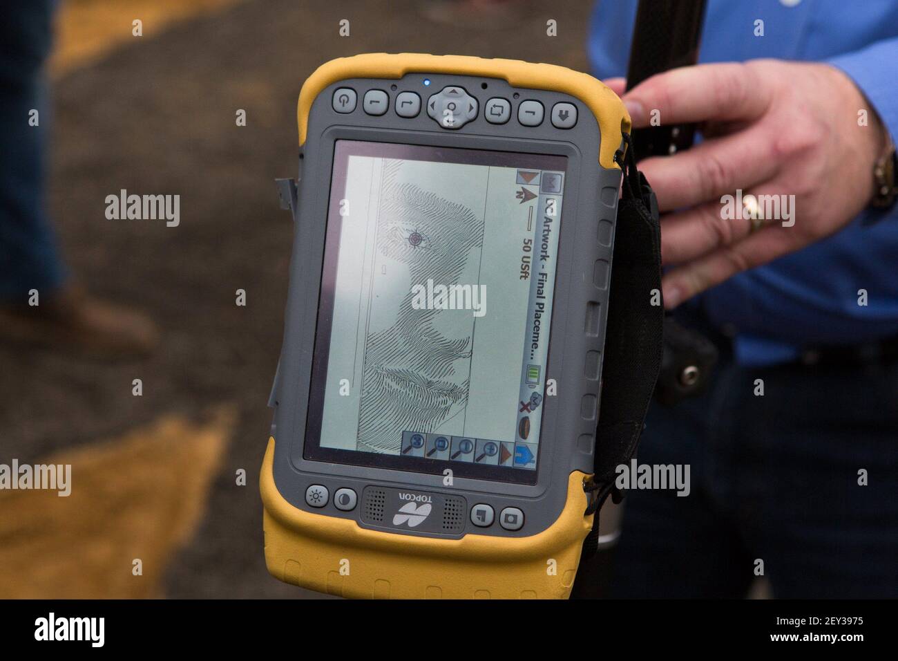 TopCon representative Mark Contino shows the GPS screen on one of the ...