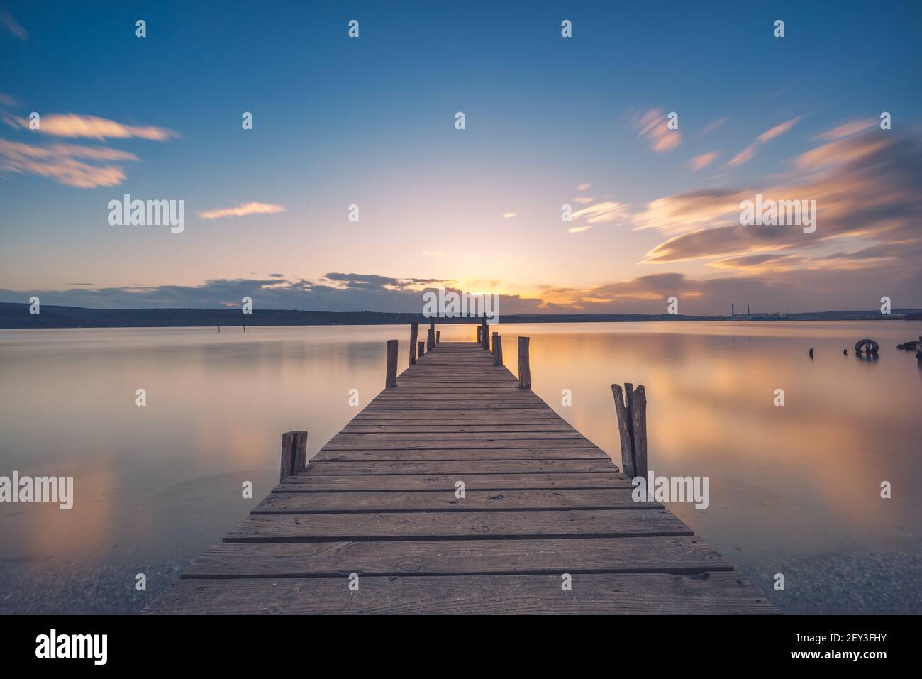 Old wooden dock at the lake, sunset shot Stock Photo - Alamy