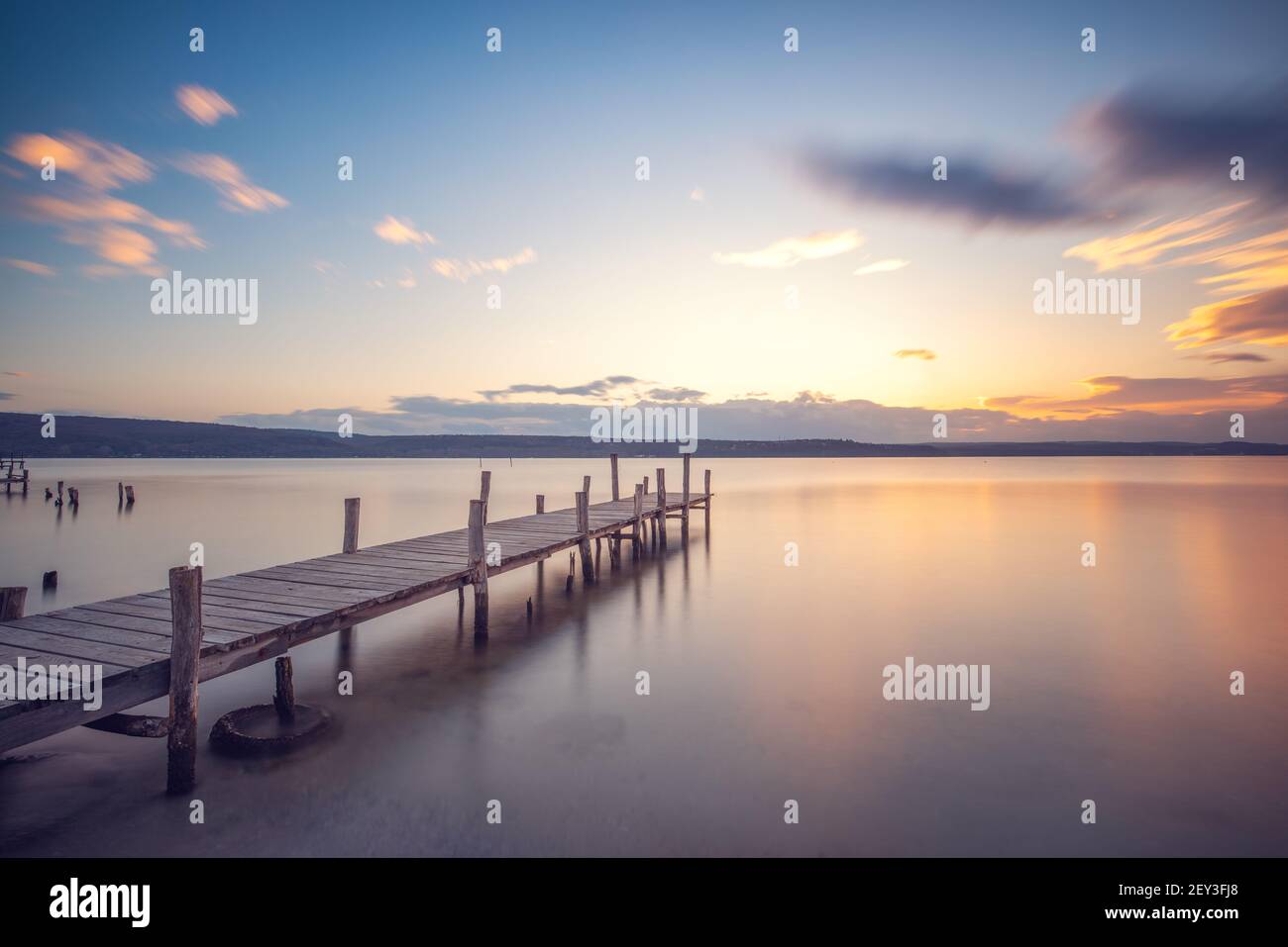 Old wooden dock at the lake, sunset shot Stock Photo - Alamy