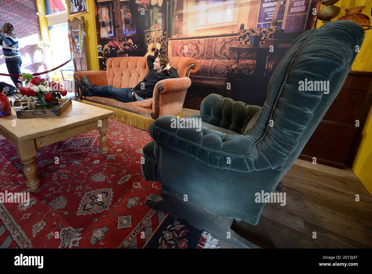 Joshua Dockter, from New York, poses for a photo on the replica of the ...