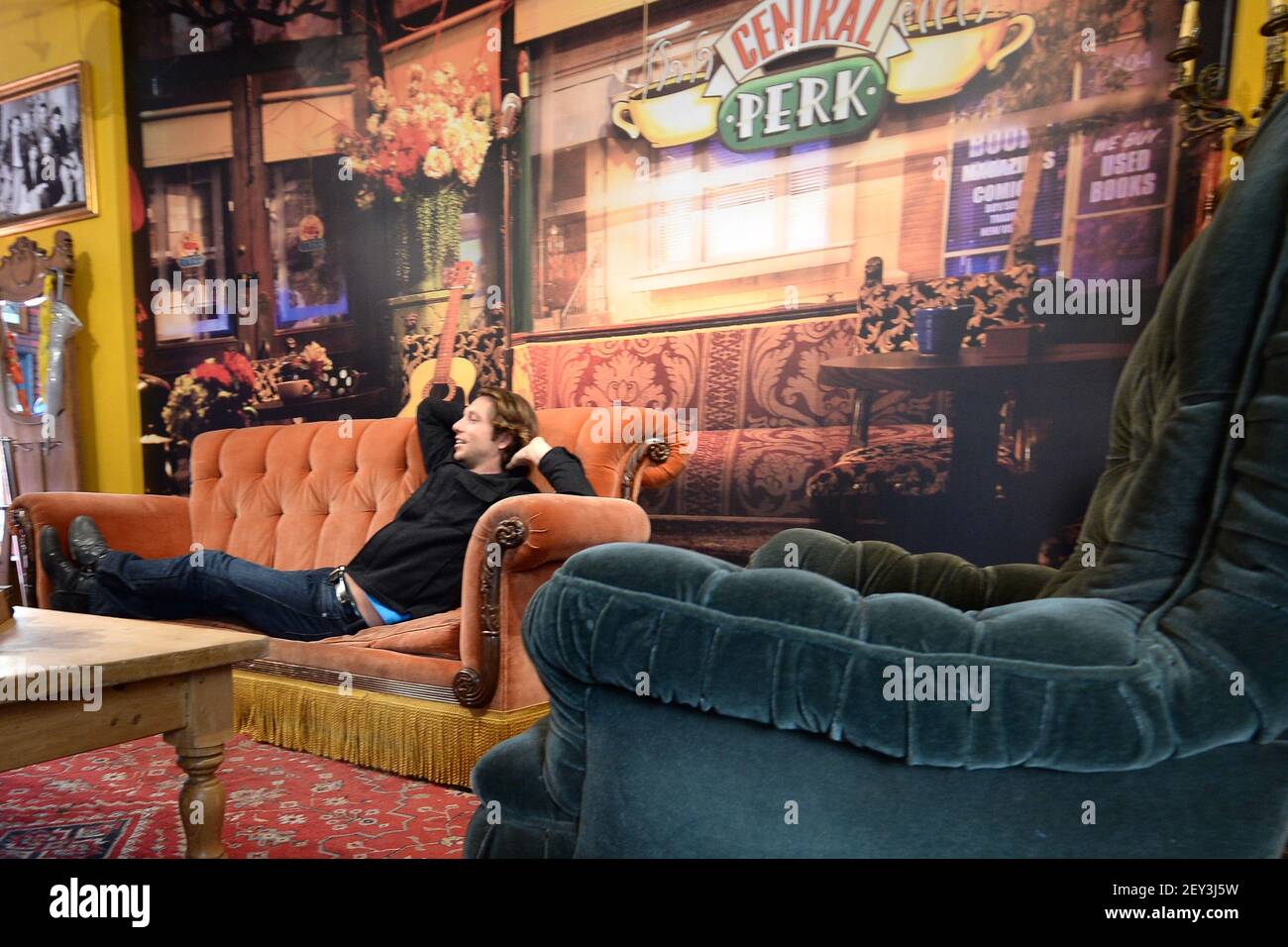 Joshua Dockter, from New York, poses for a photo on the replica of the ...