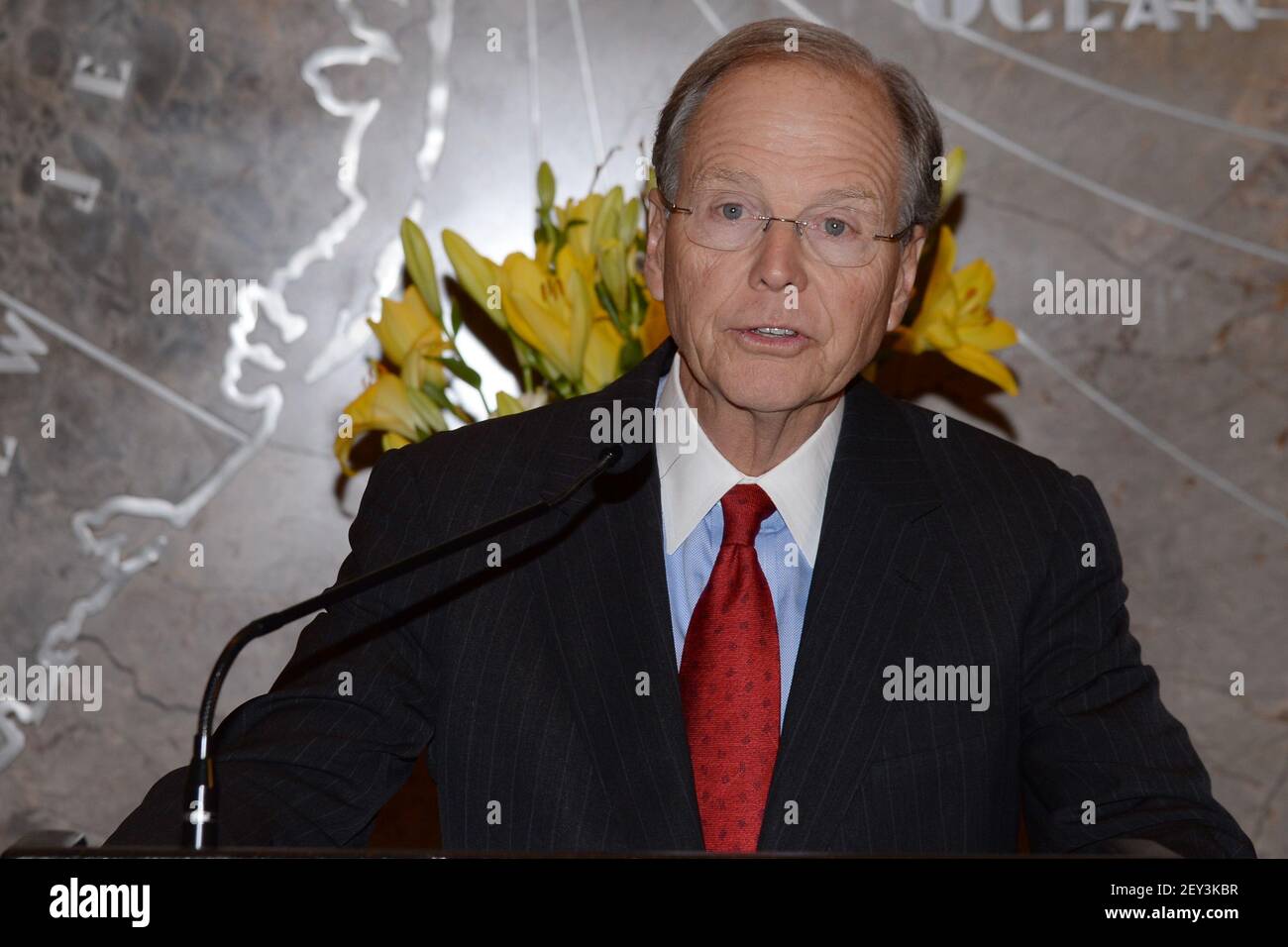 Robert Baylis, President of the Board, Rubin Museum of Art, speaks to ...