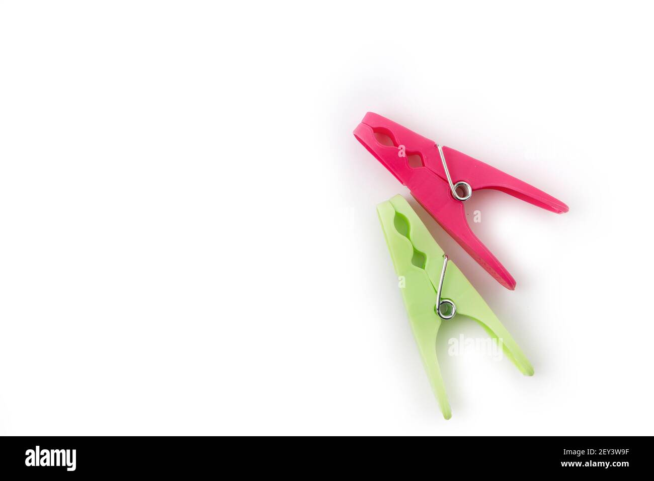 top view of two different color clothespins isolated on white ...