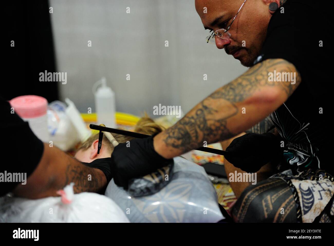 A-Town tattoo artists use traditional Polynesian tatau methods, tapping ...