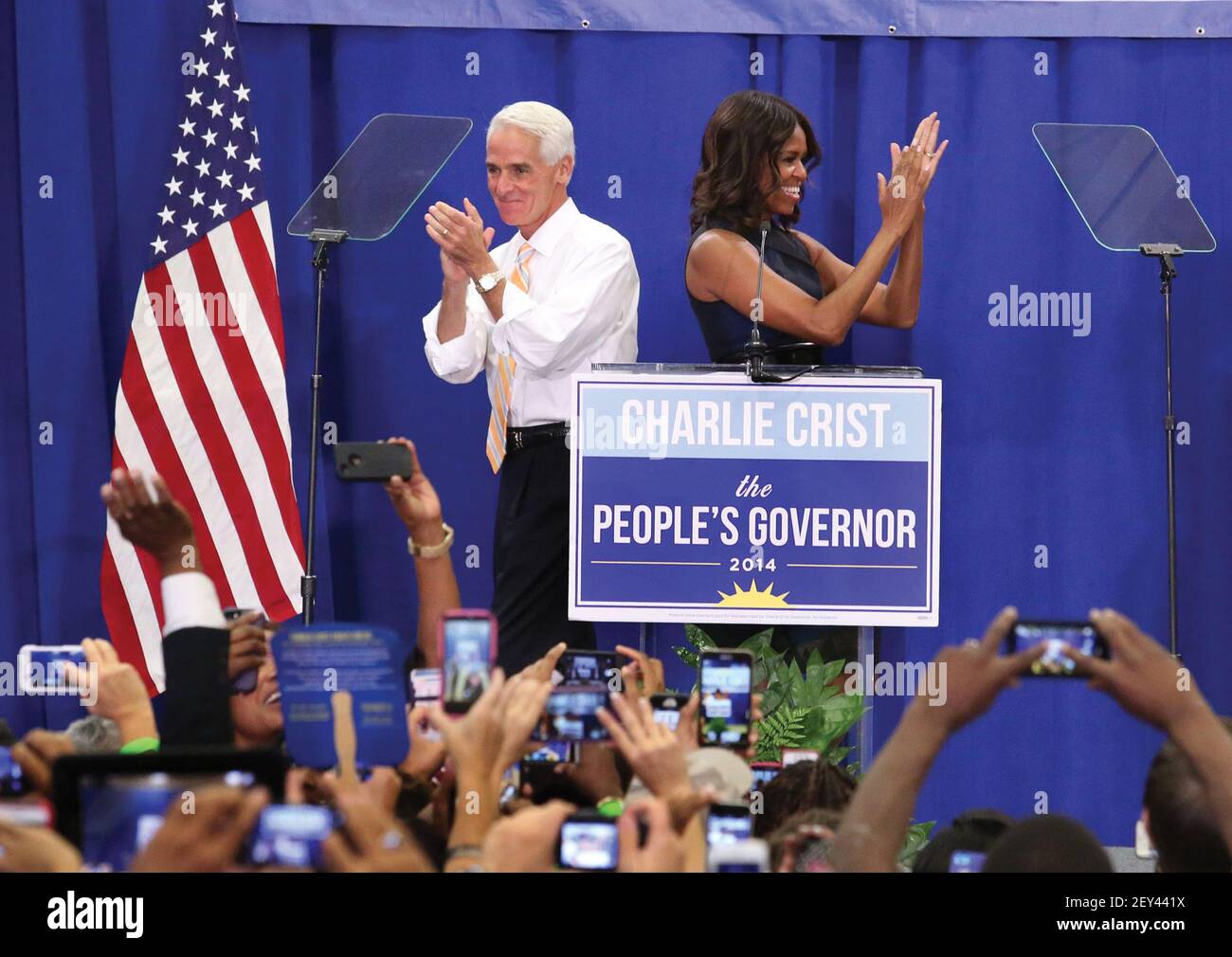 First Lady Michelle Obama campaigns for Democrat Charlie Crist, left ...