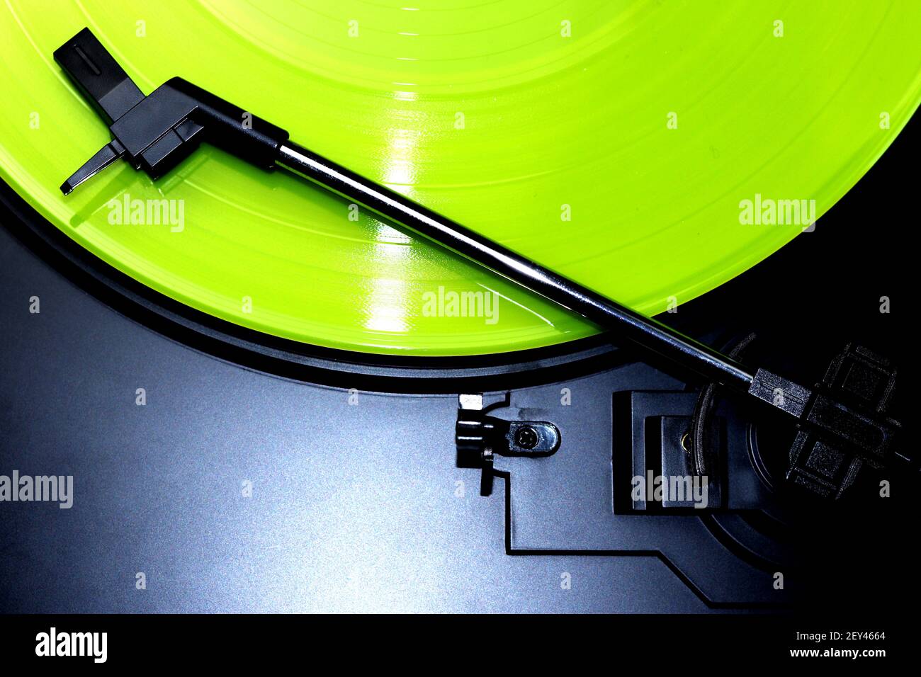 Green vinyl record spinning on a turntable - gramophone needle ...