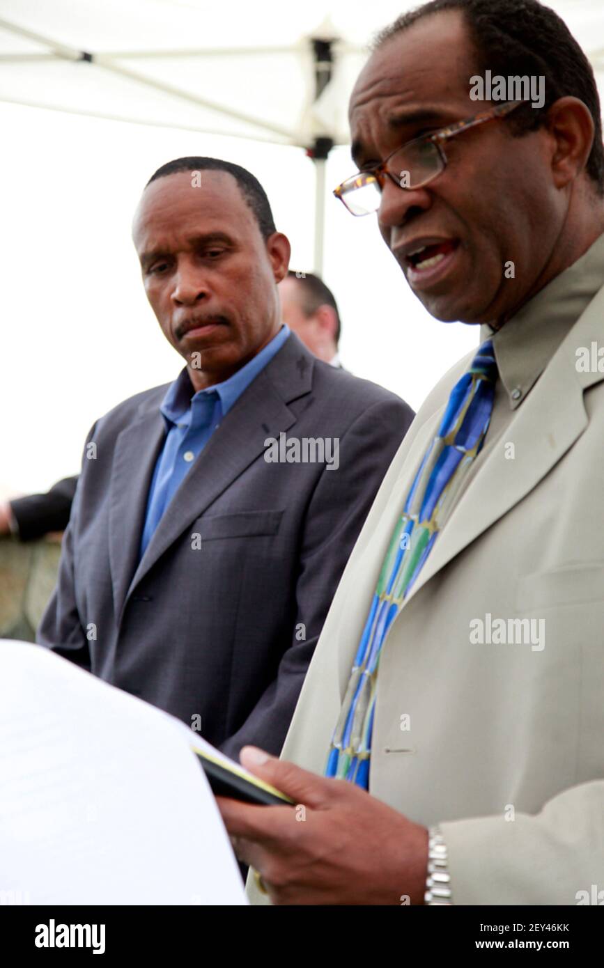Jim Jones Jr., son of cult leader Jim Jones, right, reads the names of ...
