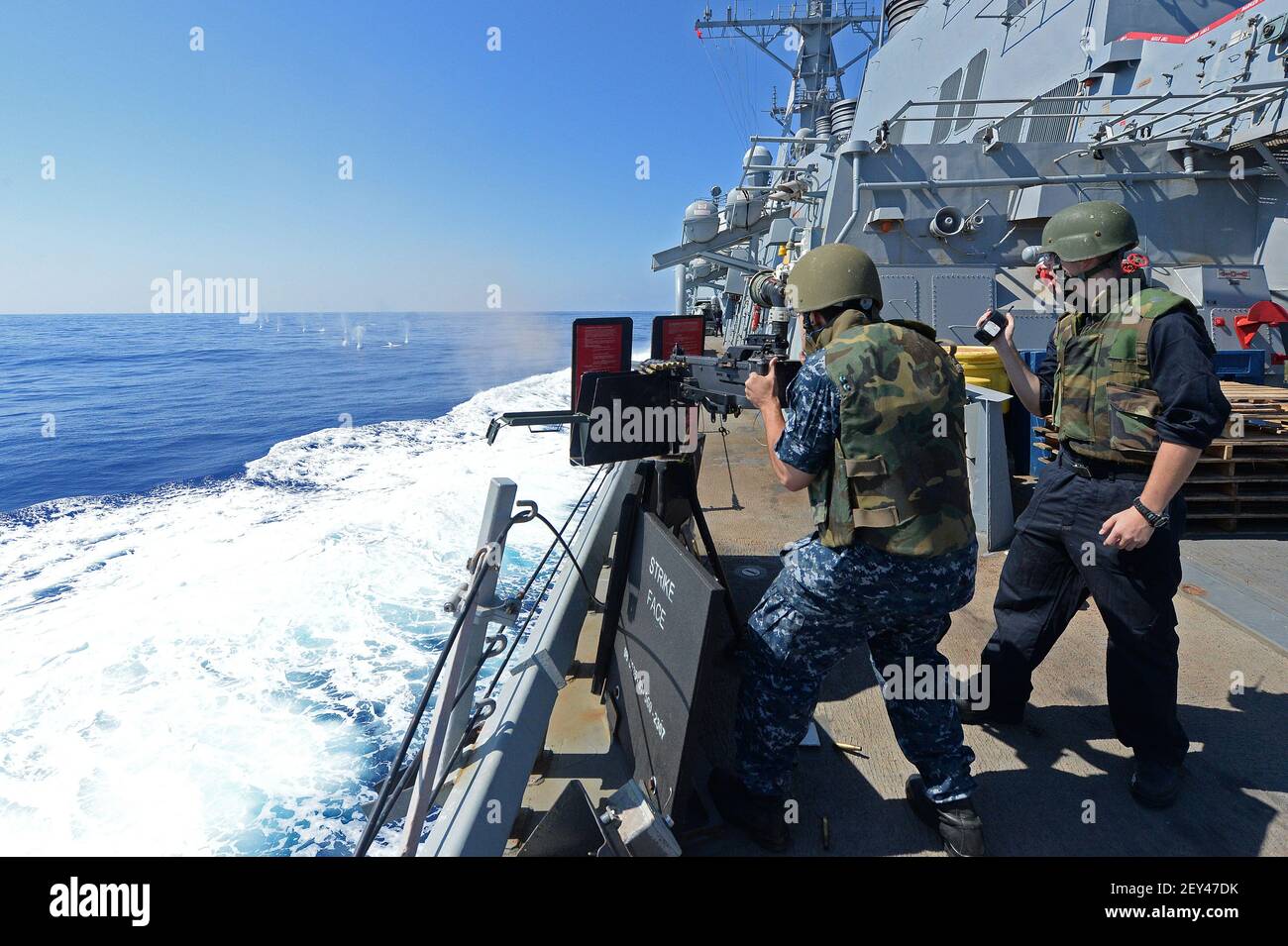 MEDITERRANEAN SEA (Sept. 20, 2014) Sailors fire a .50-caliber machine ...