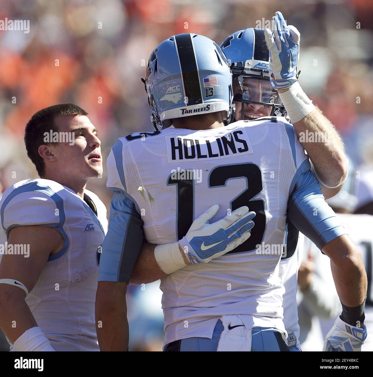 UNC's Aaron Proehl (7) and Eric Albright (49) congratulate Mack Hollins ...