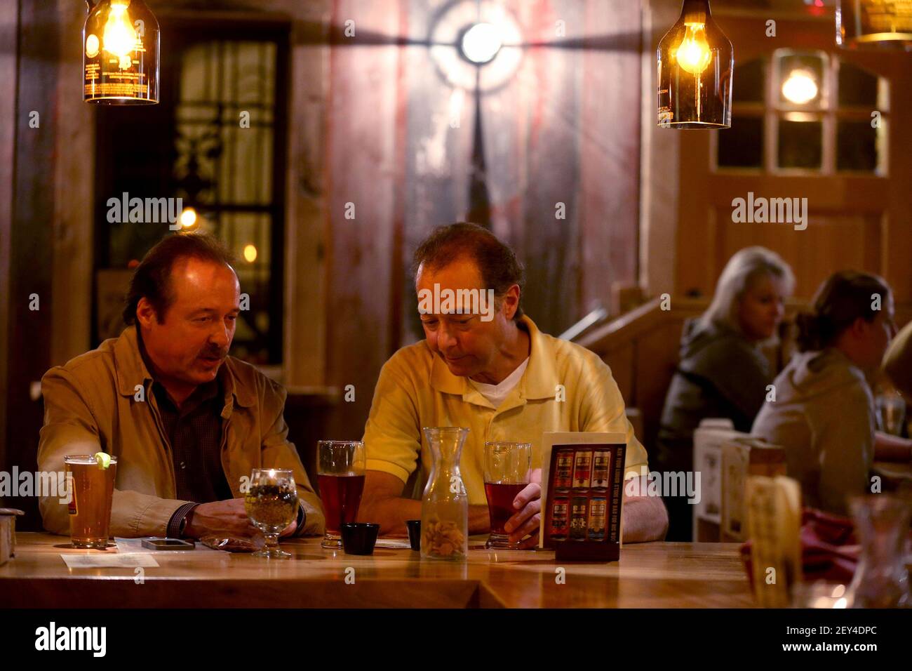 Jerry Helget, left, and Steve Marier share stories as they drink beer ...