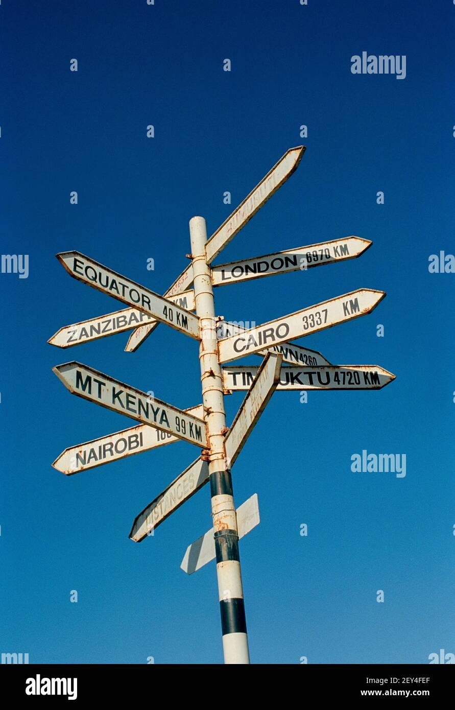 sign post in Kenya with directions and distances to other places in ...
