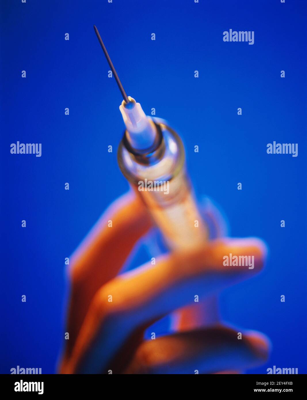 hand holding syringe in preparation for injection or inoculation Stock ...