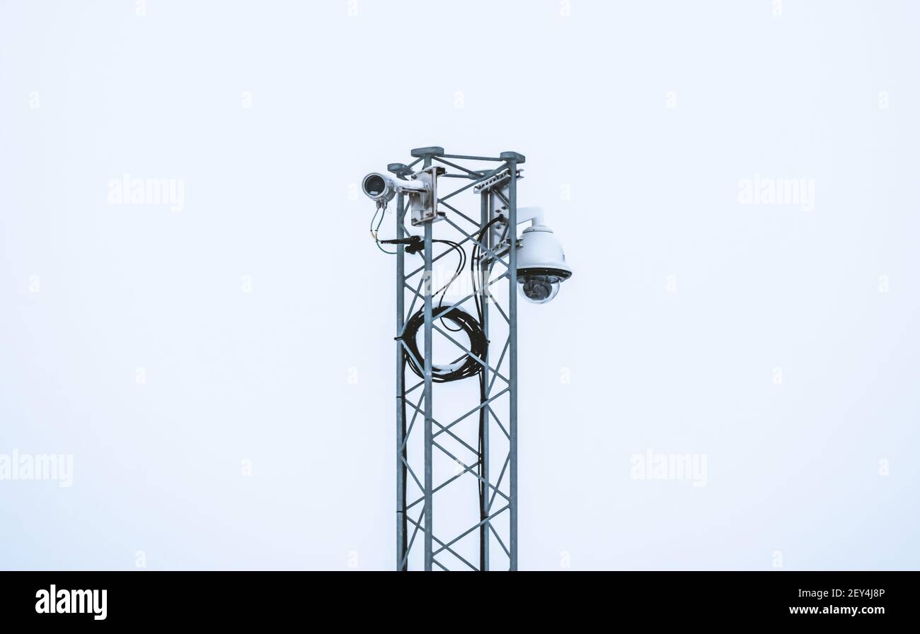 Security camera mast with equipment to provide surveillance and ...