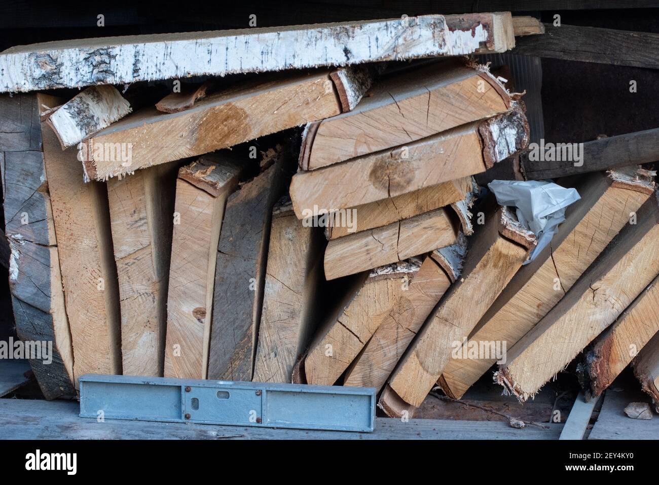 Stack of natural uneven rough wooden boards of different sizes ...