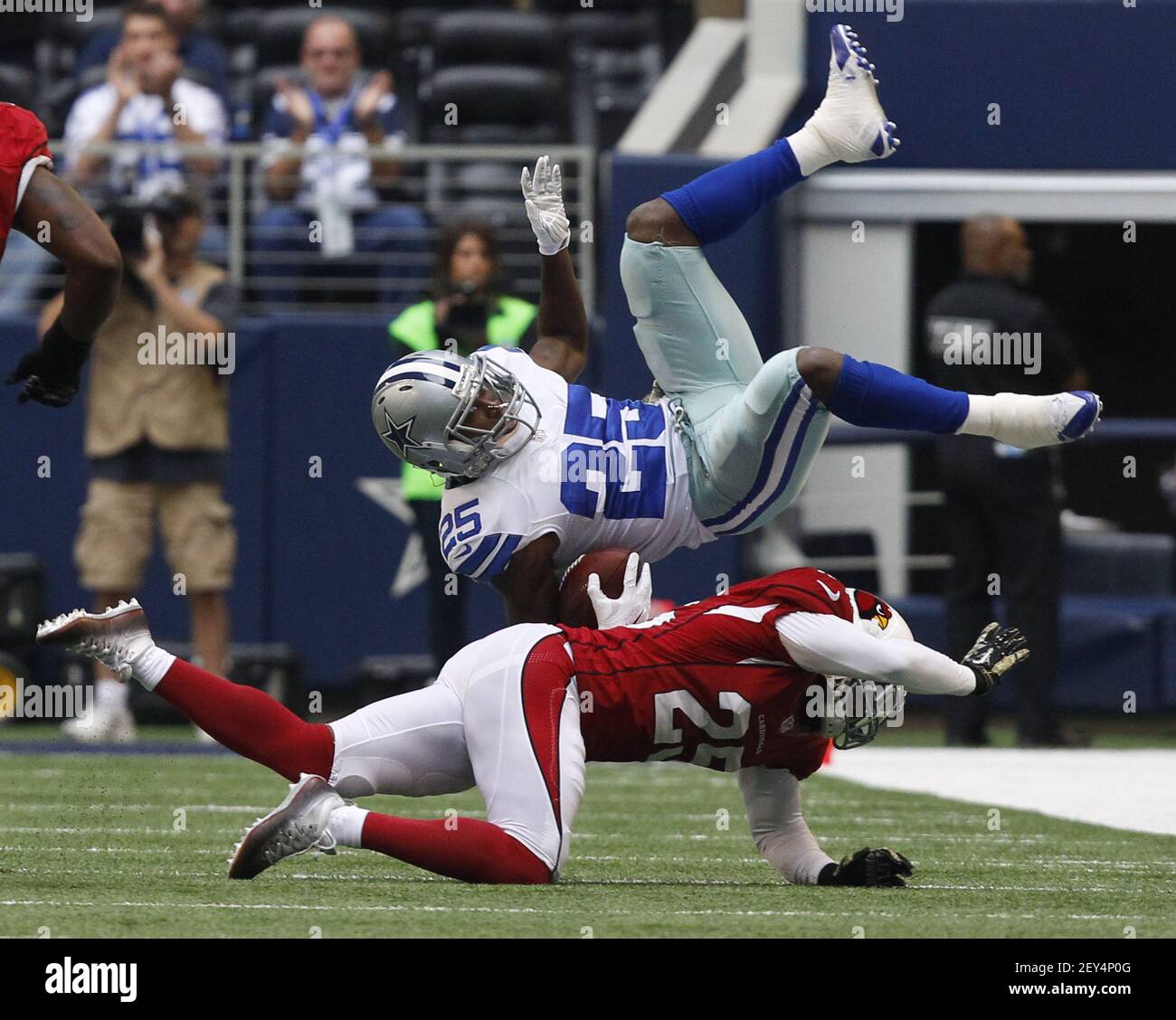 Dallas Cowboys running back Lance Dunbar (25) gets upended by Arizona ...
