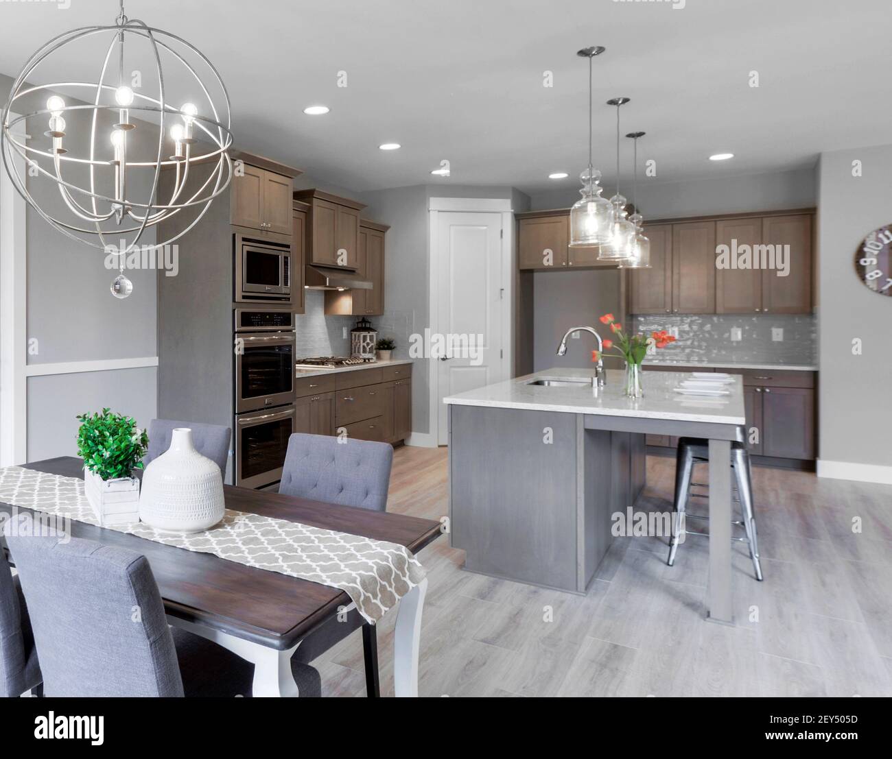 Modern residential dining room and kitchen interior Stock Photo - Alamy