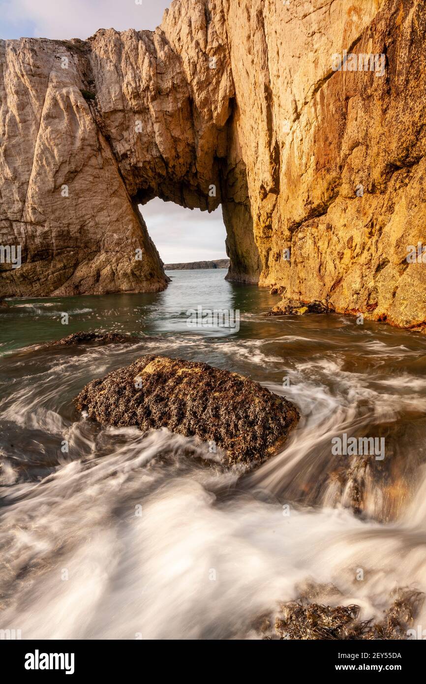 Bwa Gwyn sea arch near Rhoscolyn, Anglesey, North Wales Stock Photo - Alamy