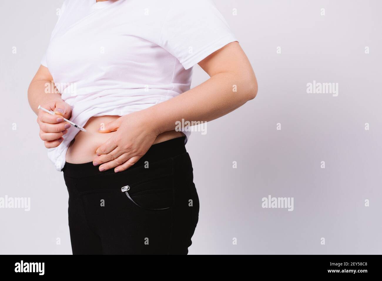 Cropped photo of a diabetic patient using insulin pen for making an ... Cropped photo of a diabetic patient using insulin pen for making an ...