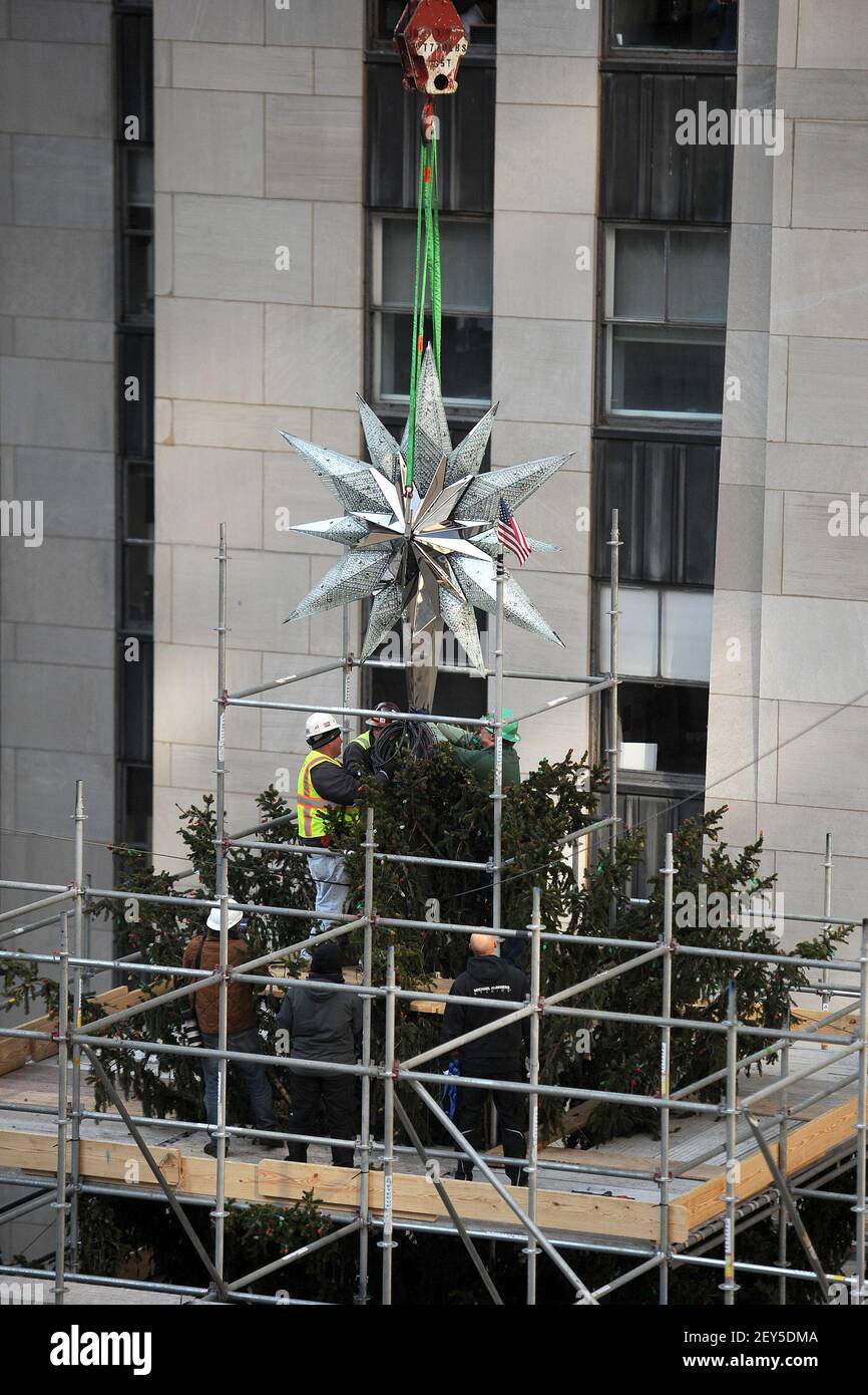 The Swarovski Star is placed on top of the 85-foot Rockefeller Center ...