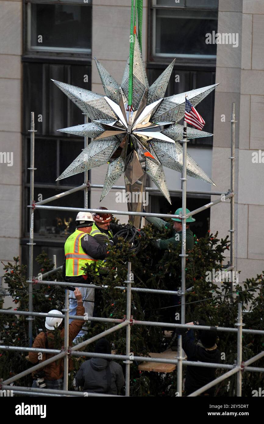 The Swarovski Star is placed on top of the 85-foot Rockefeller Center ...
