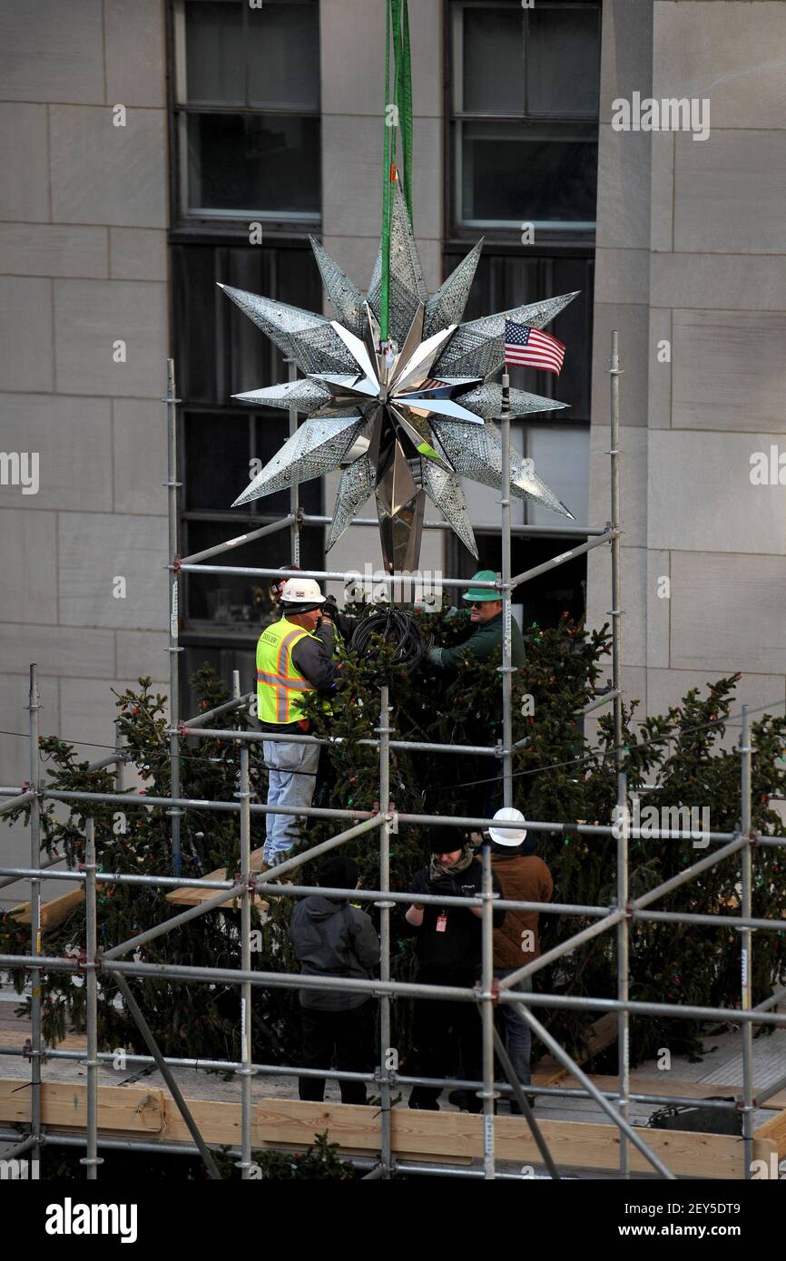 The Swarovski Star is placed on top of the 85-foot Rockefeller Center ...