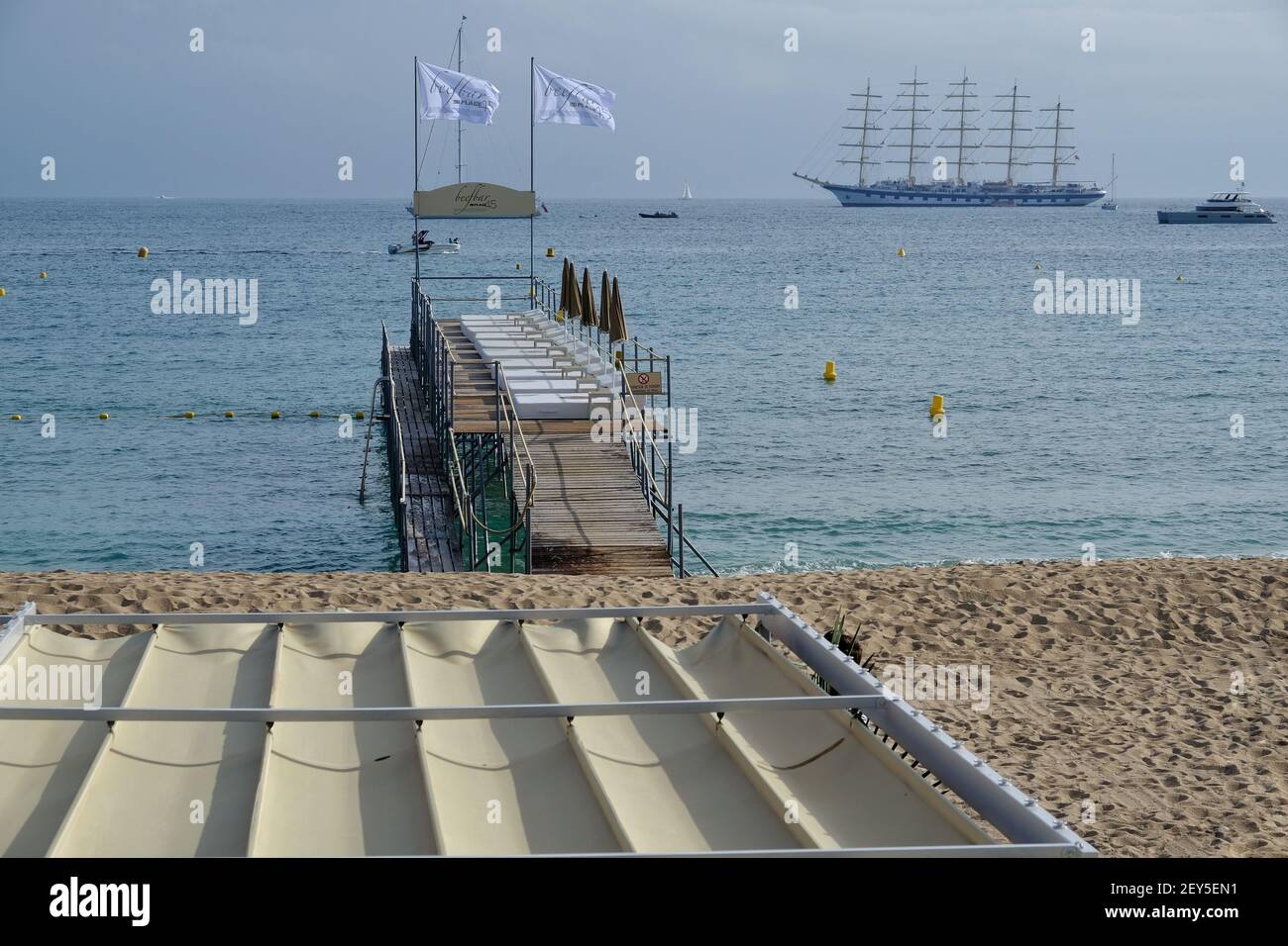 Cannes, France - May 13, 2017 : A wooden pier at the beach and a five ...
