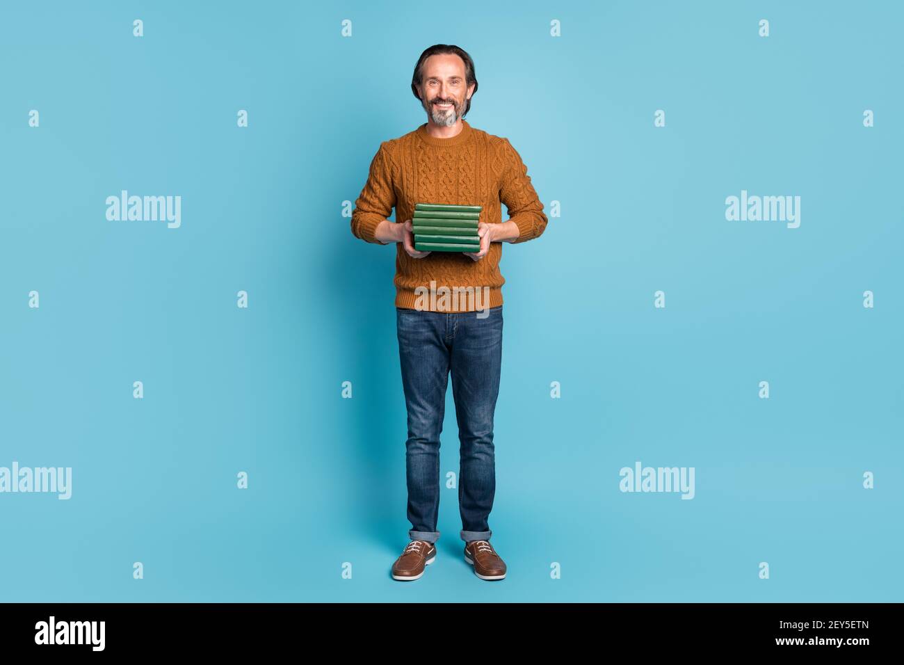 Full length body size photo middle-aged bearded man smiling keeping ...