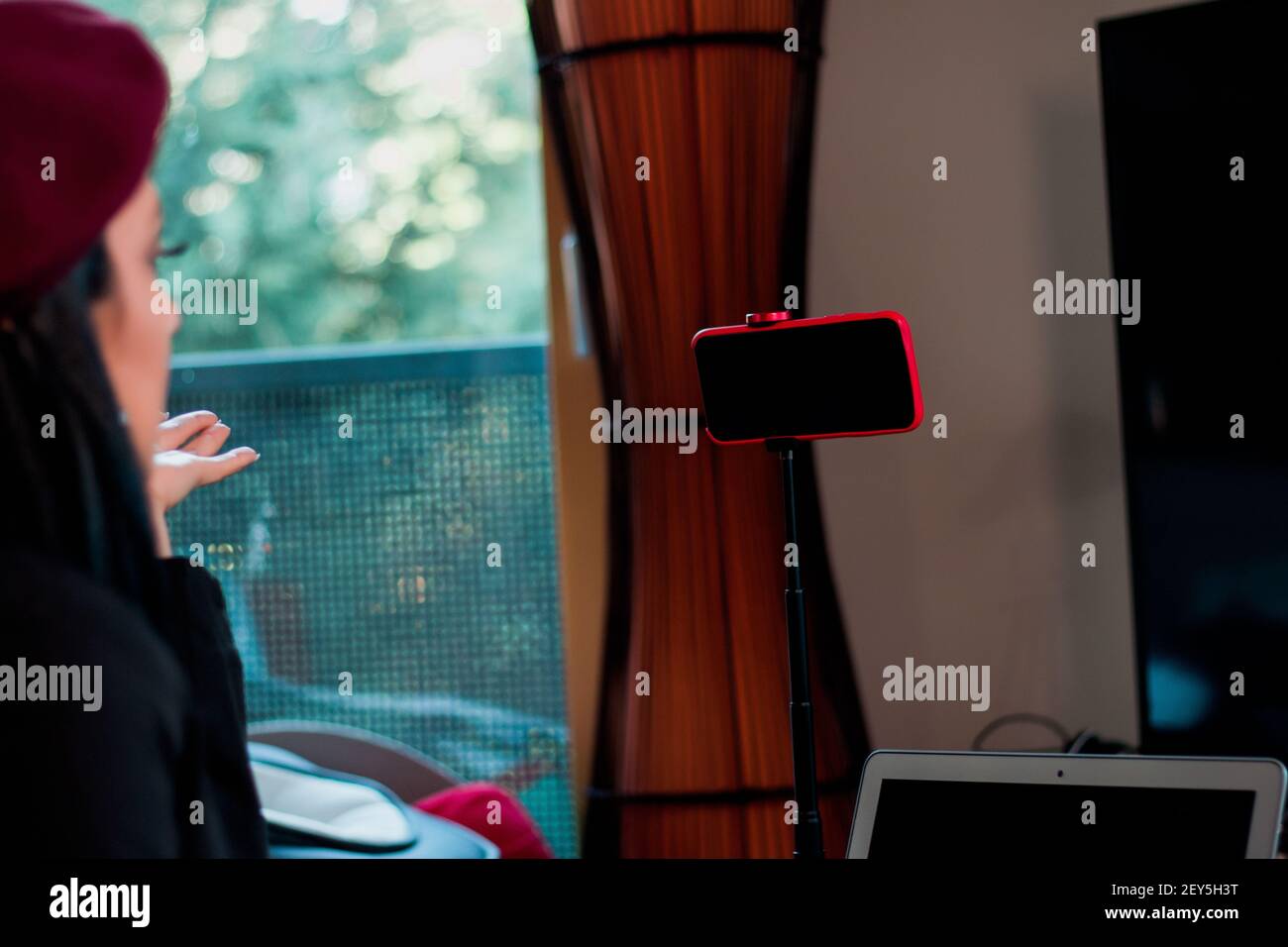 A girl video blogger or beauty blogger recording a video for ...