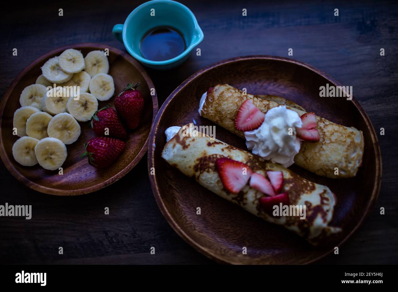Overhead of crepes and fruit on a table Stock Photo - Alamy