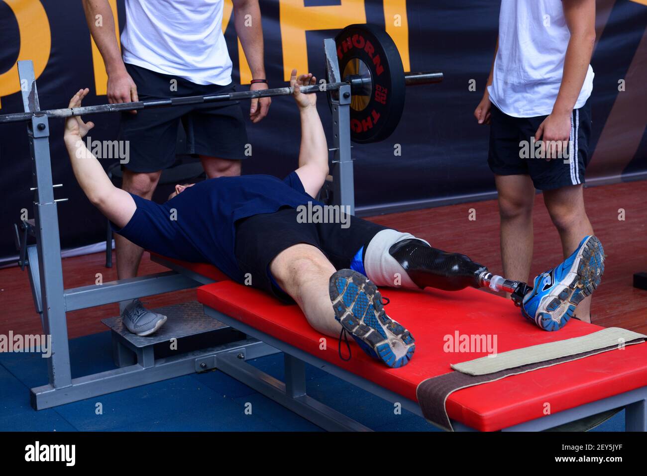 Male disabled athlete lifting barbell in a gym. Kiev, Ukraine. October ...