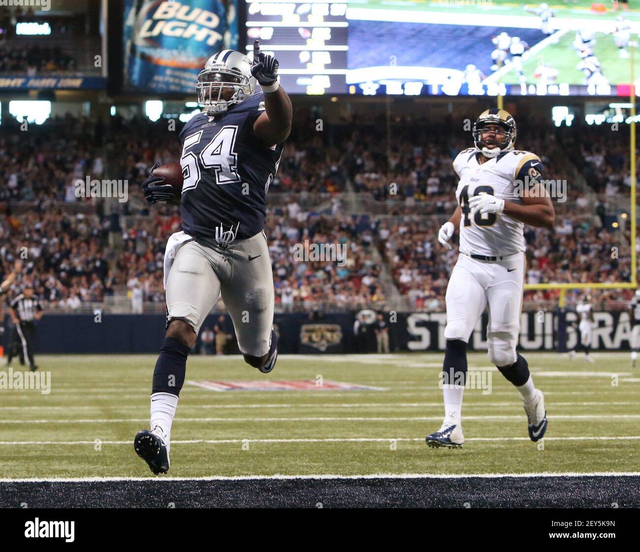 Dallas Cowboys linebacker Bruce Carter celebrates as he returns an ...