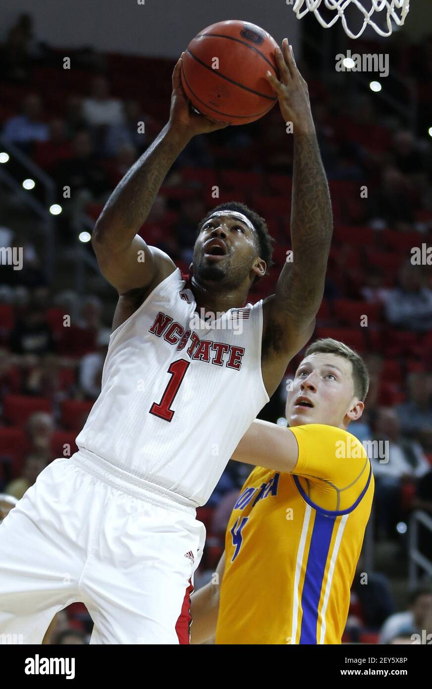 N.C. State's Trevor Lacey (1) shoots in front of Hofstra's Rokas Gustys ...