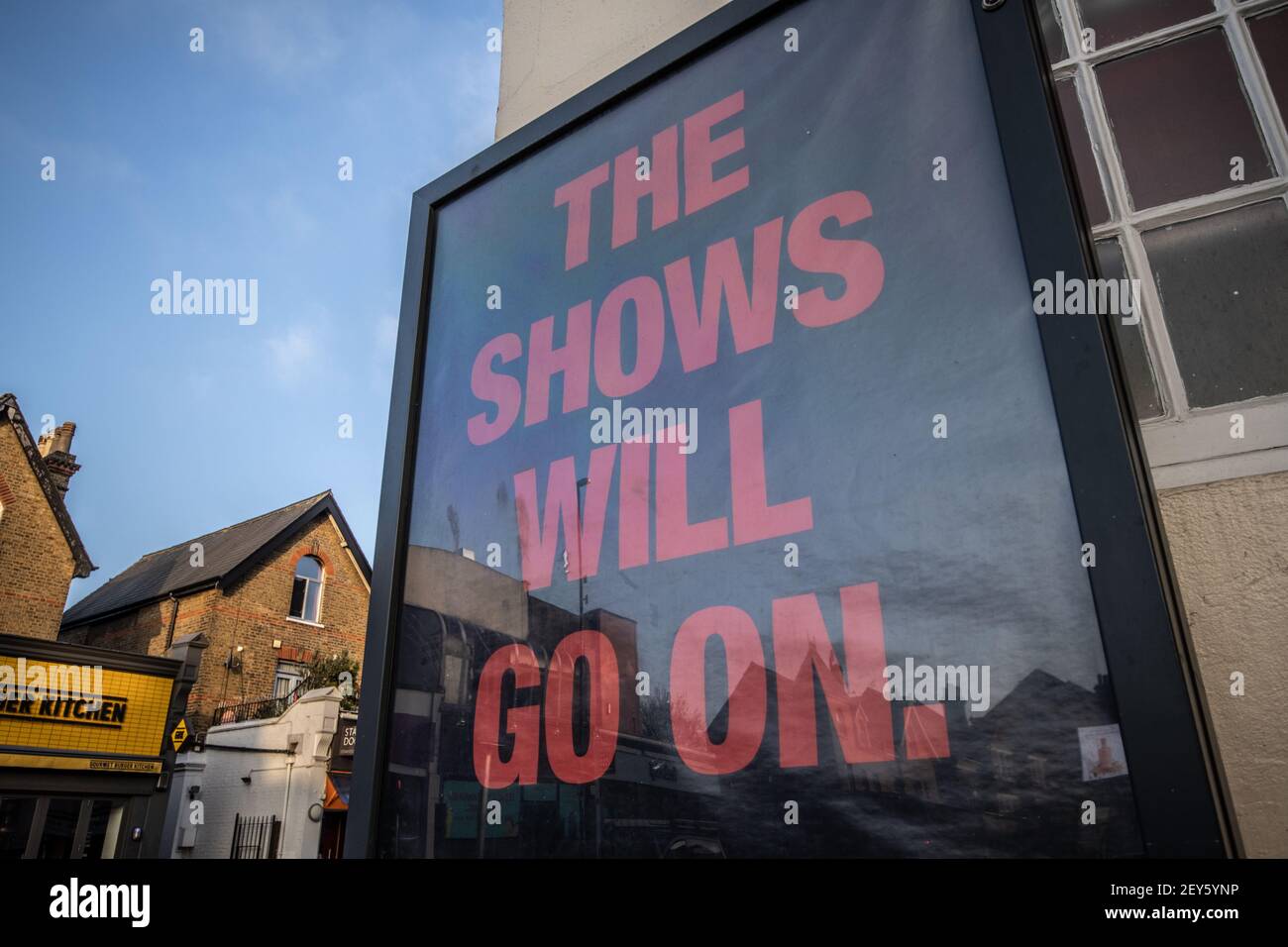'The Shows Will Go On' framed poster hung on the exterior of The ...
