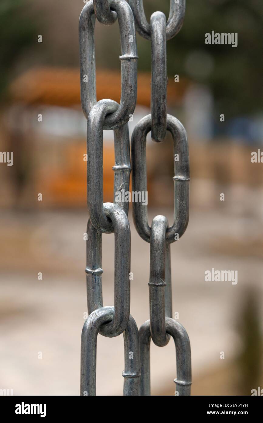 Strong shiny silver chain, outdoors, park background. Object Stock ...