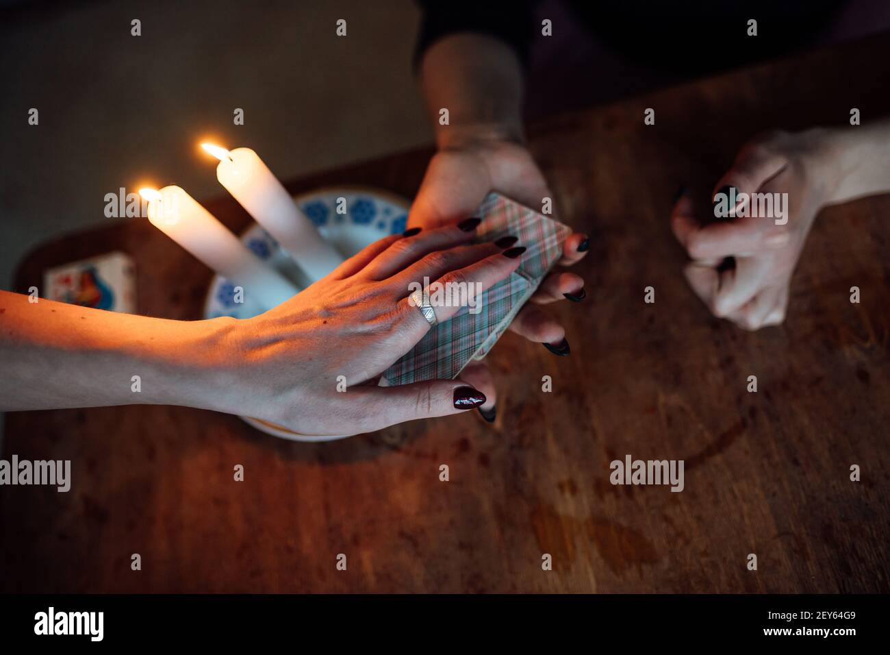 choose a card from the hands of a fortune teller. a woman tells ...