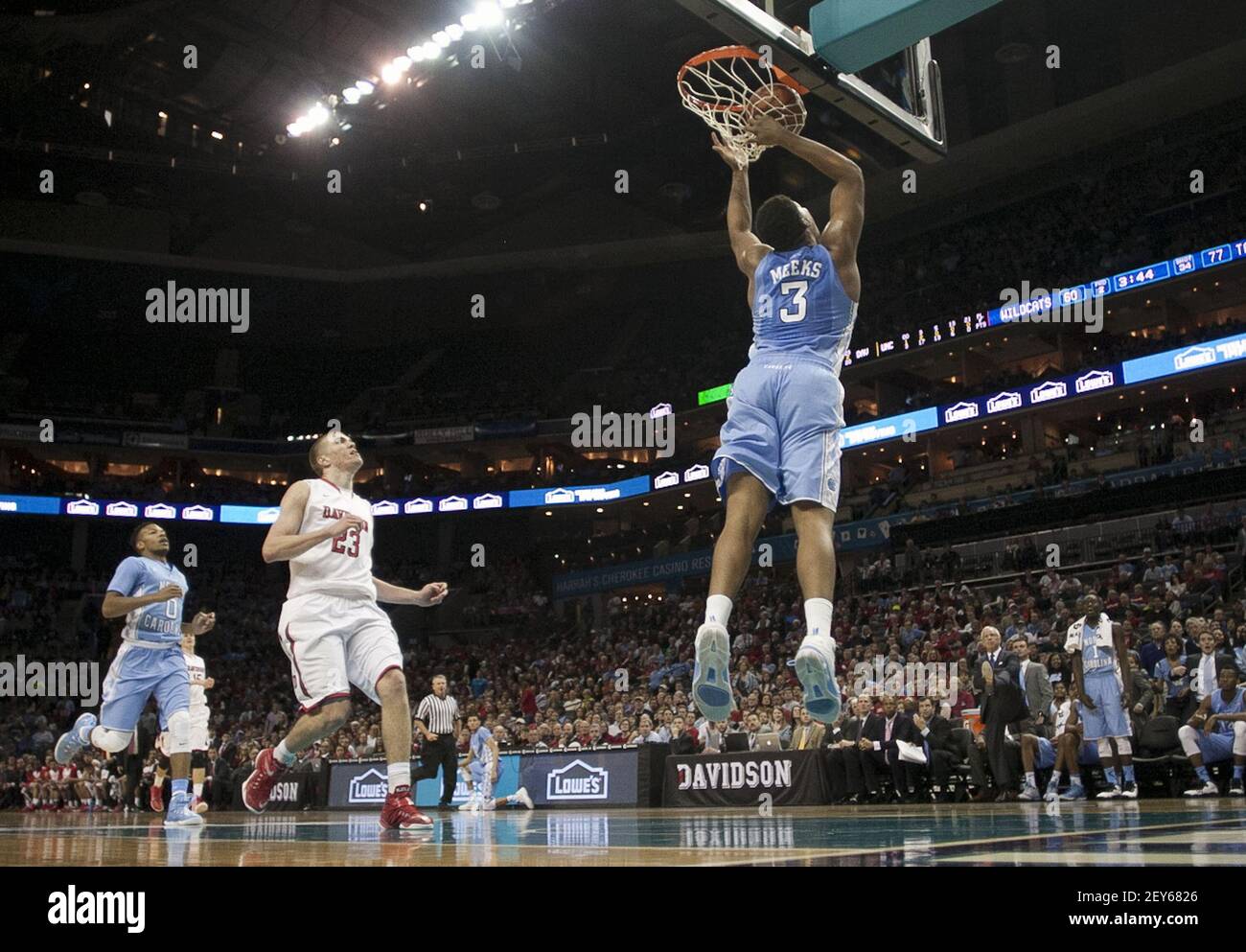 UNC's Kennedy Meeks (3) dunks on a fast break ahead of Davidson's ...