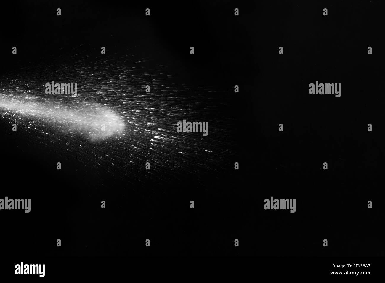 Curly white steam rising up and splashing water scattering in different ...