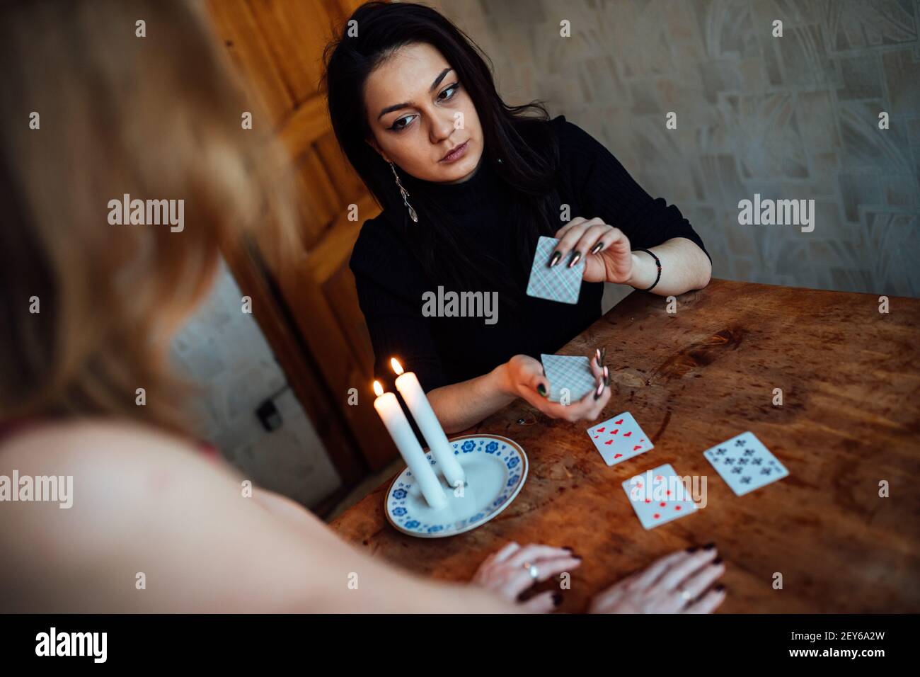 choose a card from the hands of a fortune teller. a woman tells ...