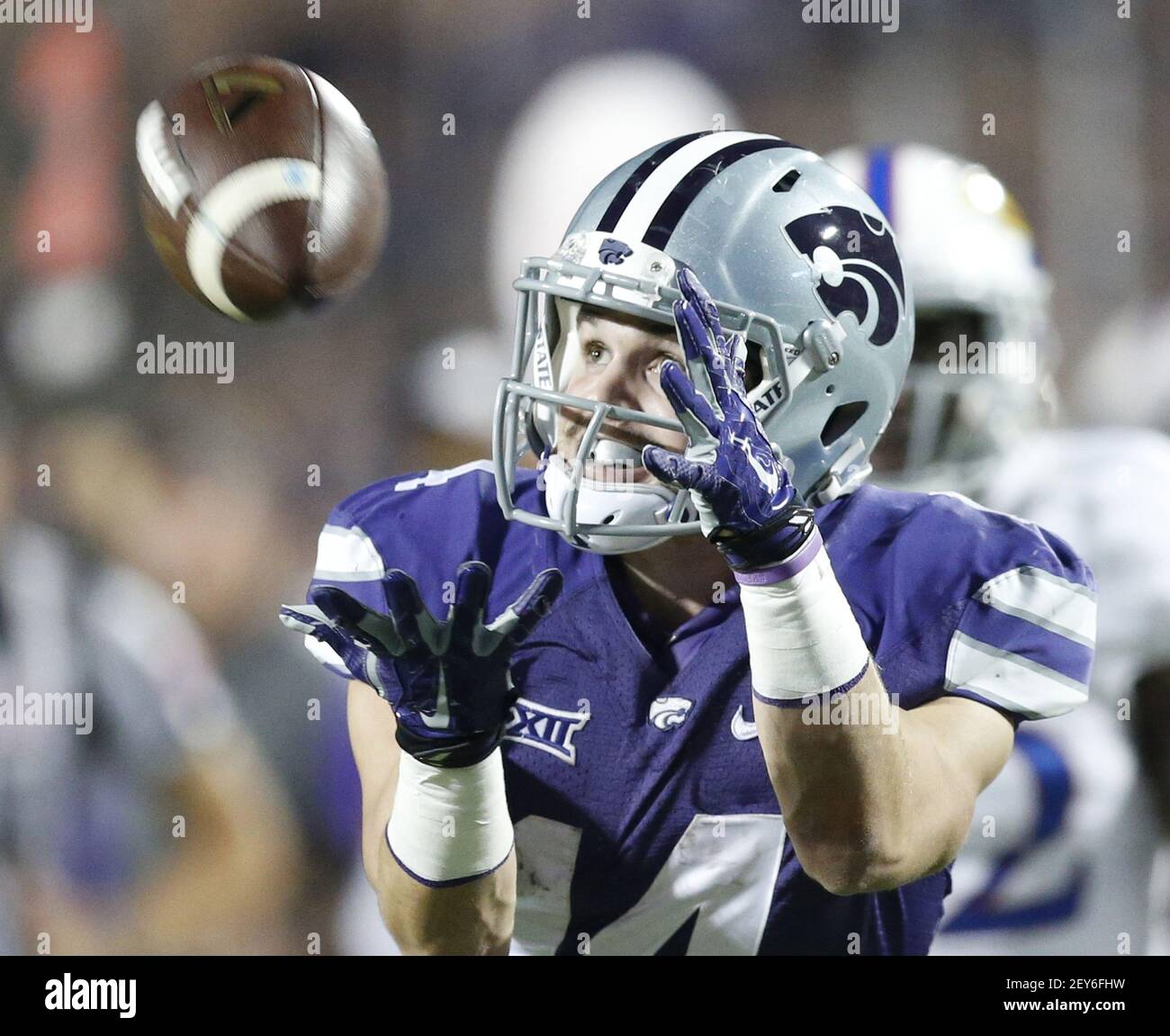 Kansas State wide receiver Curry Sexton (14) keeps his eye on a Jake ...
