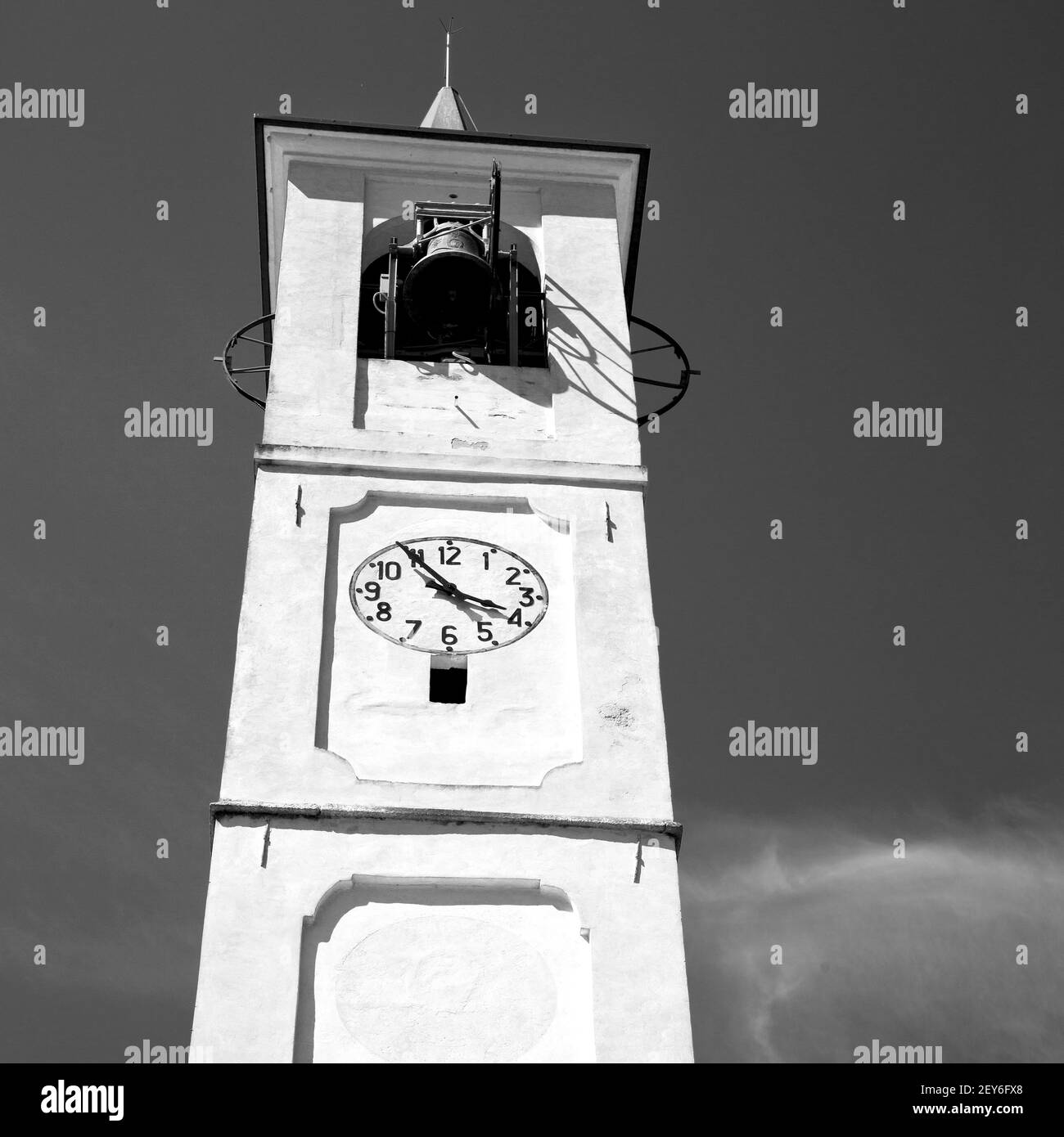 Monument clock tower in italy europe old stone and bell Stock Photo - Alamy