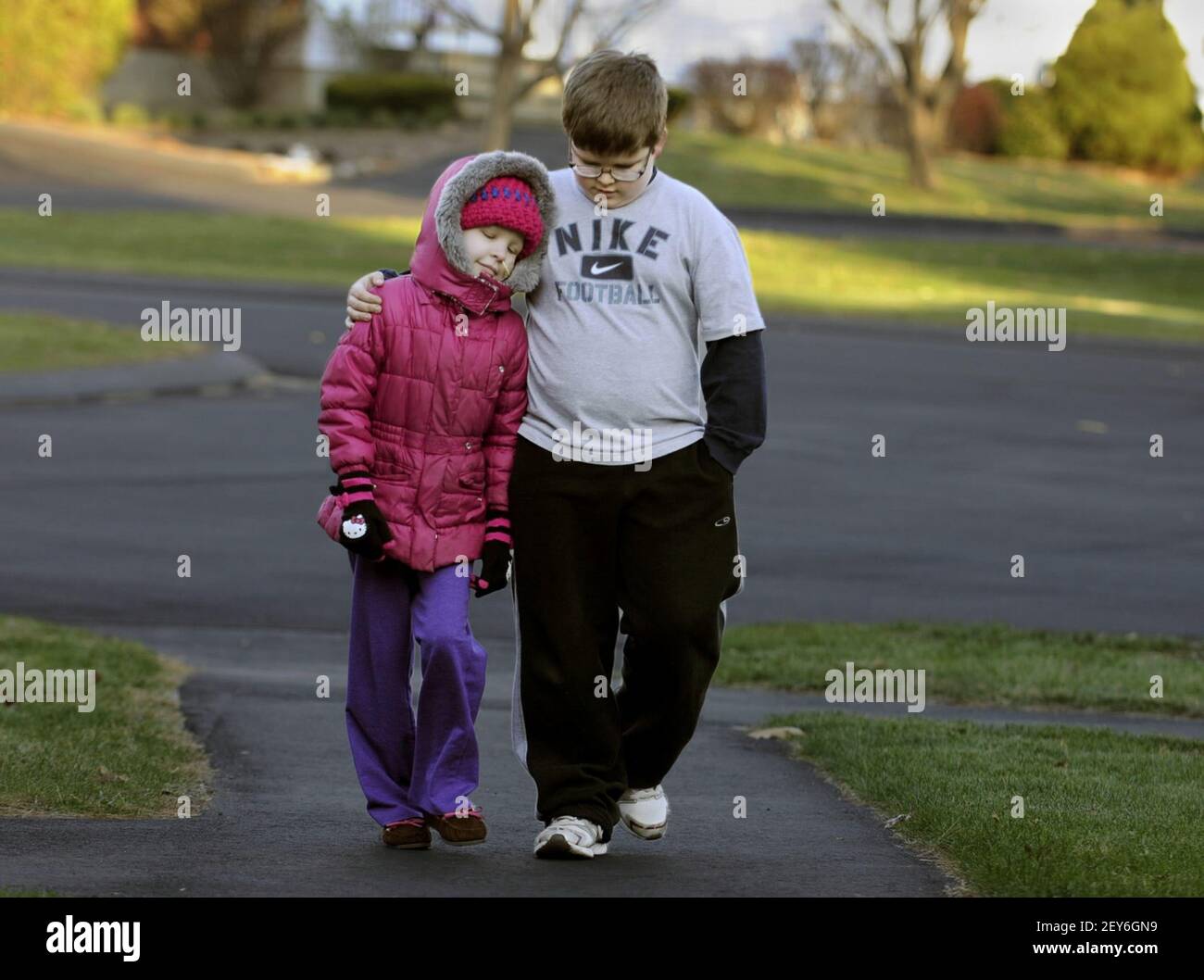 Emma Duffin, 8, walks back to the house with her brother Alex, 11, at ...