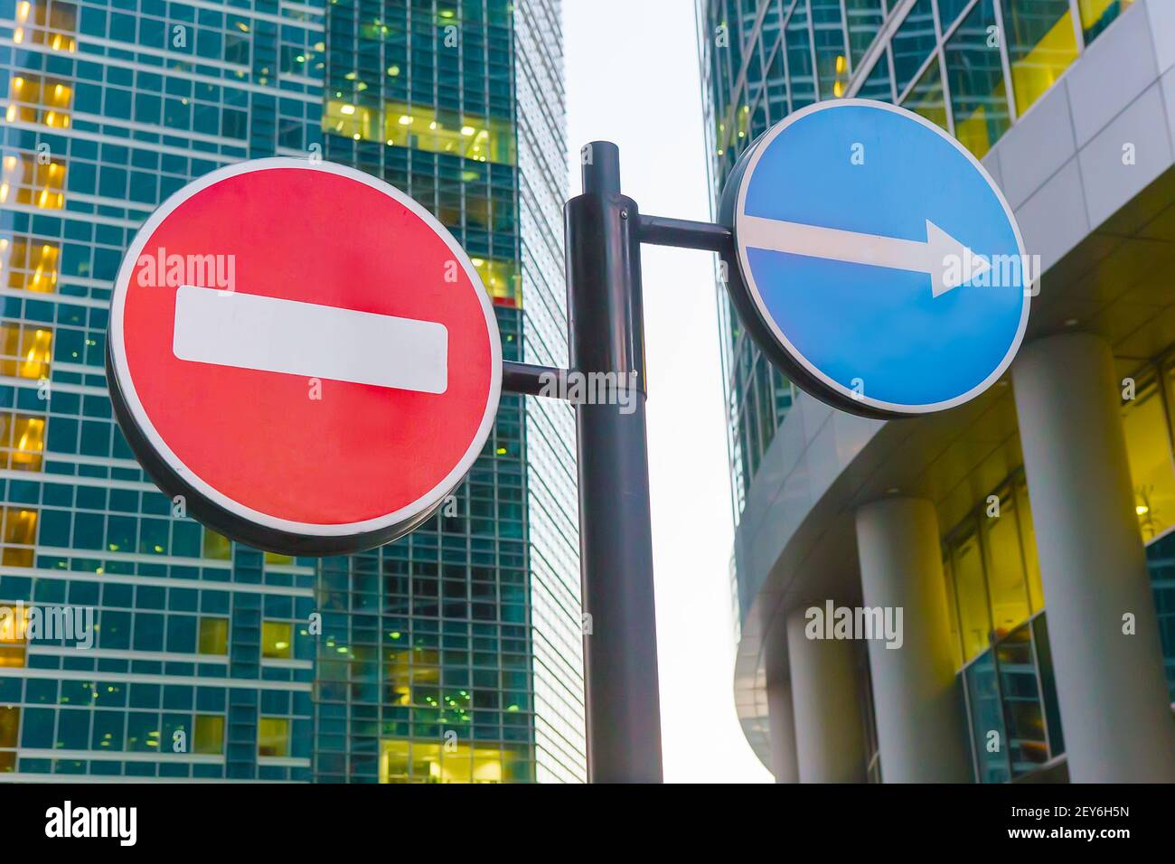 traffic signs in front of modern skyscrapers Stock Photo - Alamy