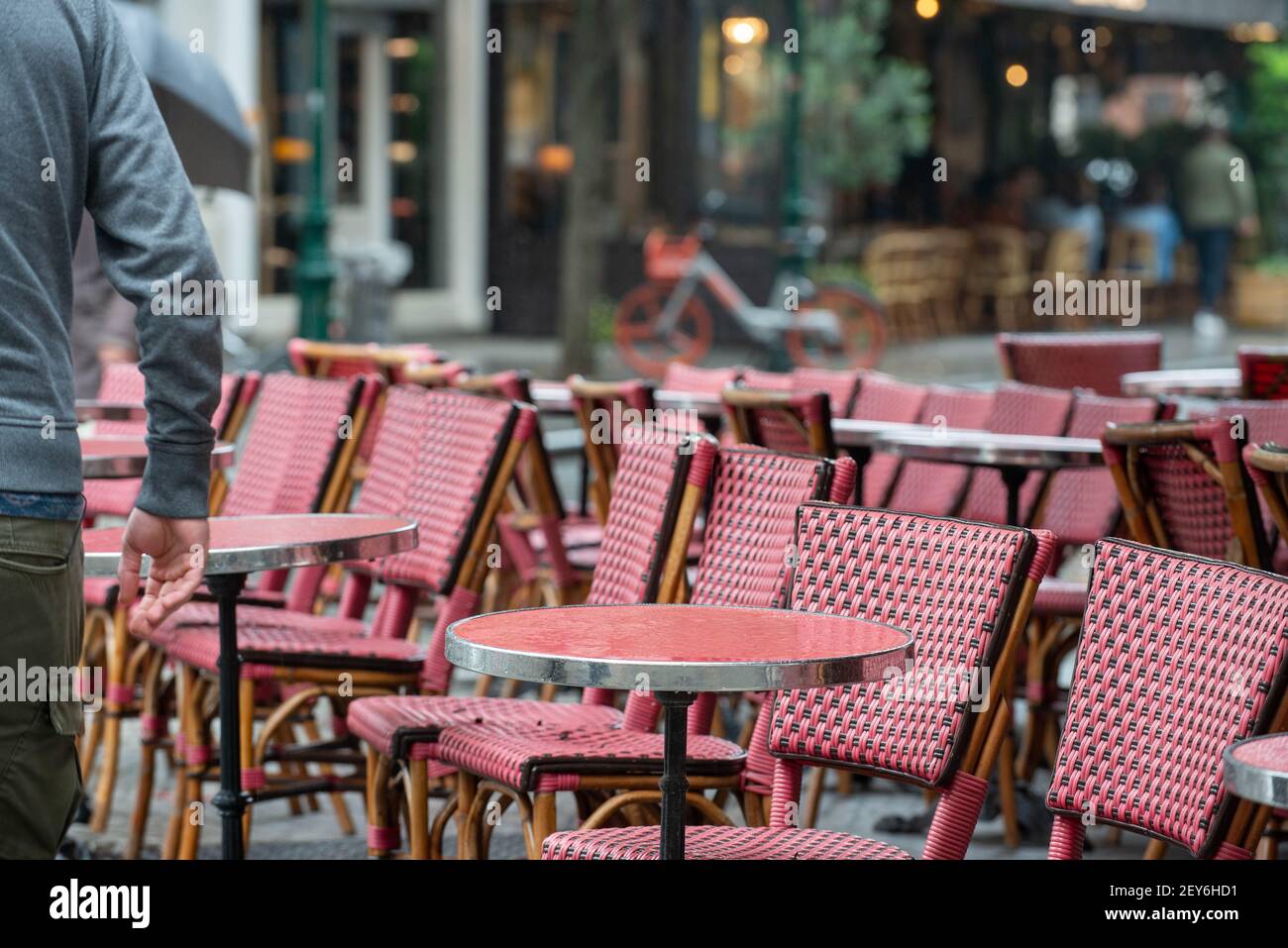 Parisian café terrace with red rattan furniture a rainy day Stock Photo ...