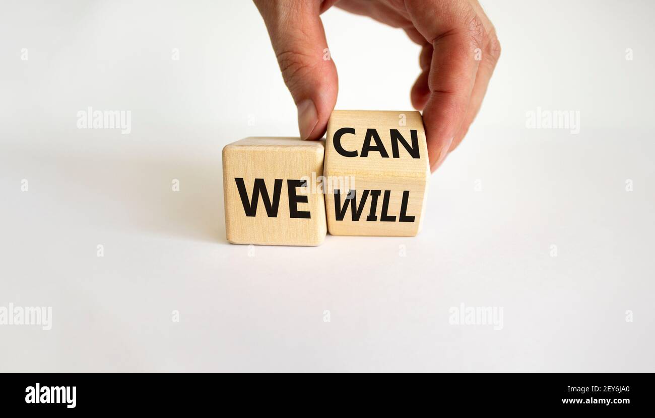 We can and will symbol. Businessman turns cubes and changes words we ...