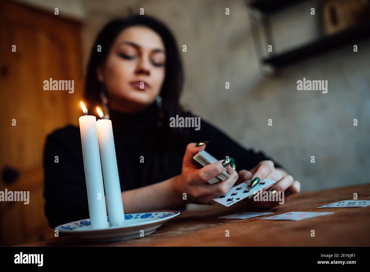 a fortune teller lights ritual candles to predict the future using ...
