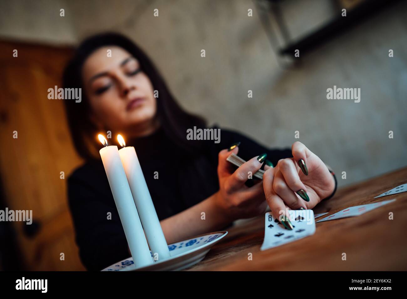 a fortune teller lights ritual candles to predict the future using ...