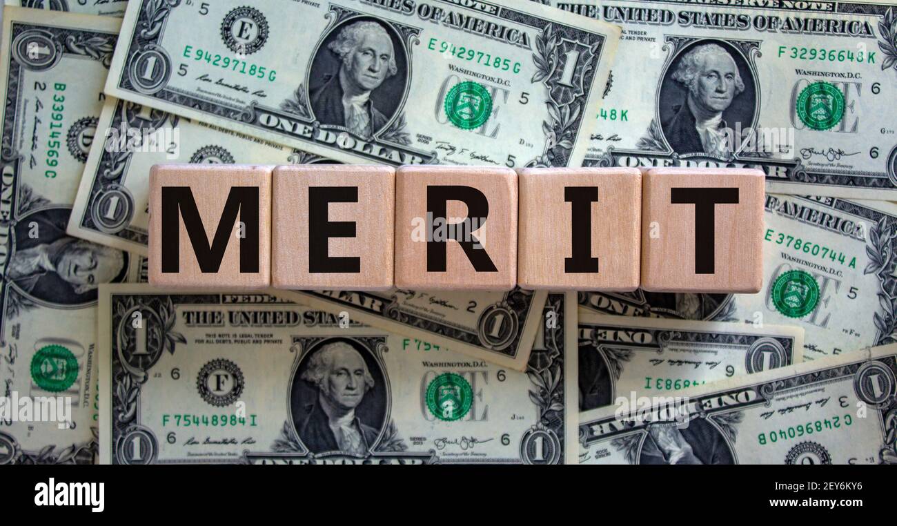 Merit symbol. Wooden cubes with the word 'merit'. Beautiful background ...
