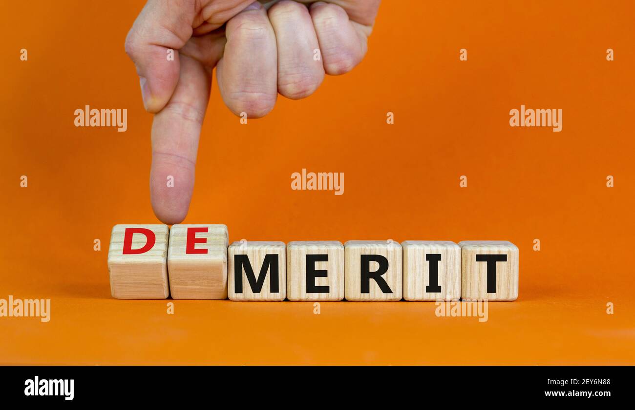 Demerit or merit symbol. Businessman turns wooden cubes and changes ...