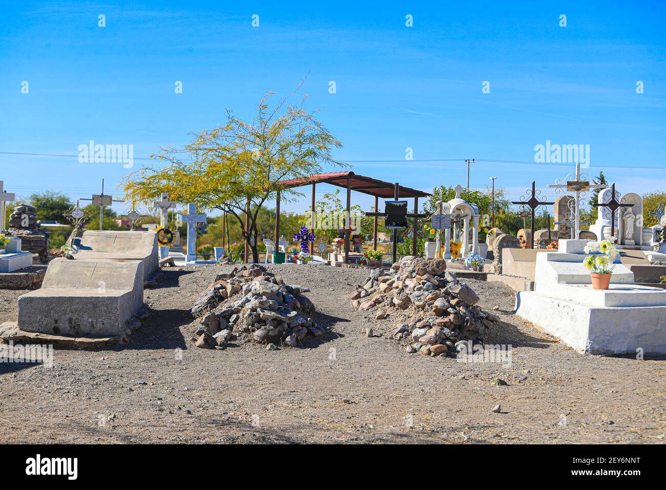 Headstones and graves in the cemetery in the town of Oquitoa, Sonora ...