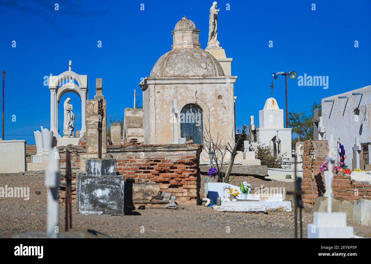Headstones and old graves from the cemetery in the town of Oquitoa ...